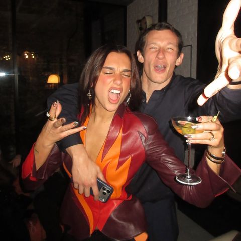 Dua Lipa looks like literal fire in a plunging flaming leather top and ...