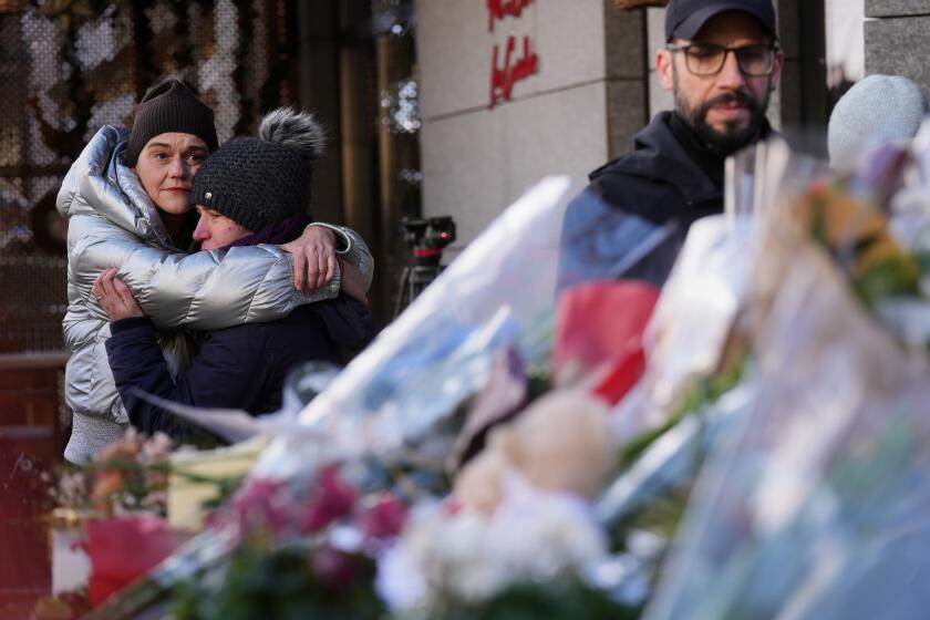 Swiss investigators believe sparkling candles atop wine bottles ignited ...