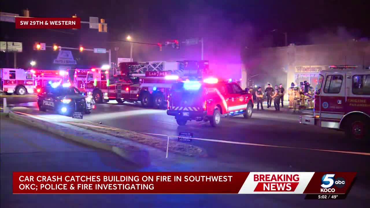 Two dead after car crashes into building, sparking fire