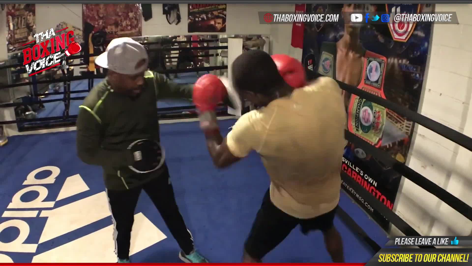 Richardson Hitchins doing mitt work with assistant coach Lenny Wilson ...