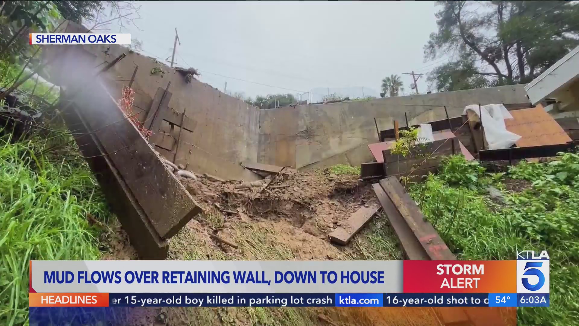 Mud flows over retaining wall, down to house in Sherman Oaks