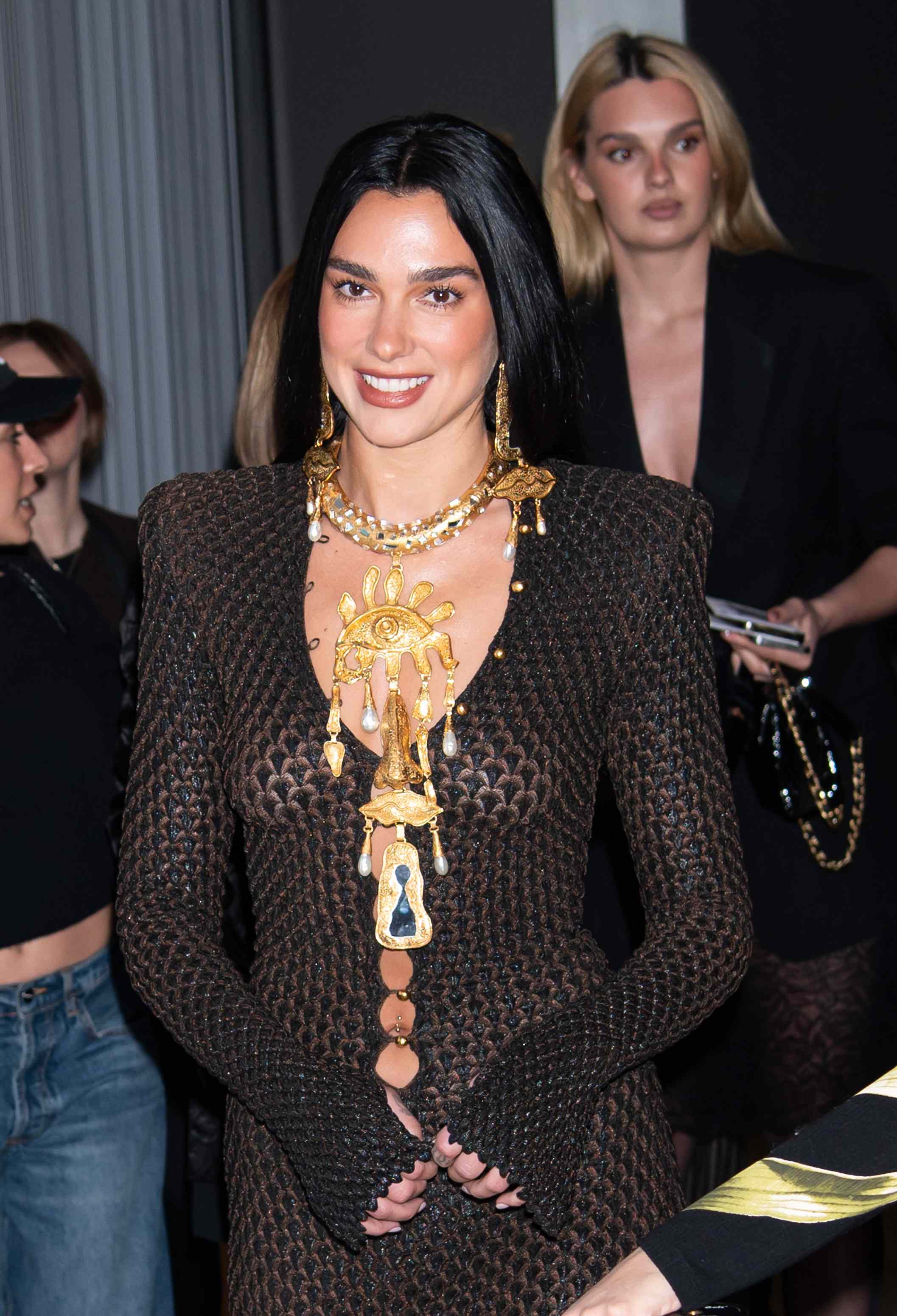 Dua Lipa looks like literal fire in a plunging flaming leather top and ...