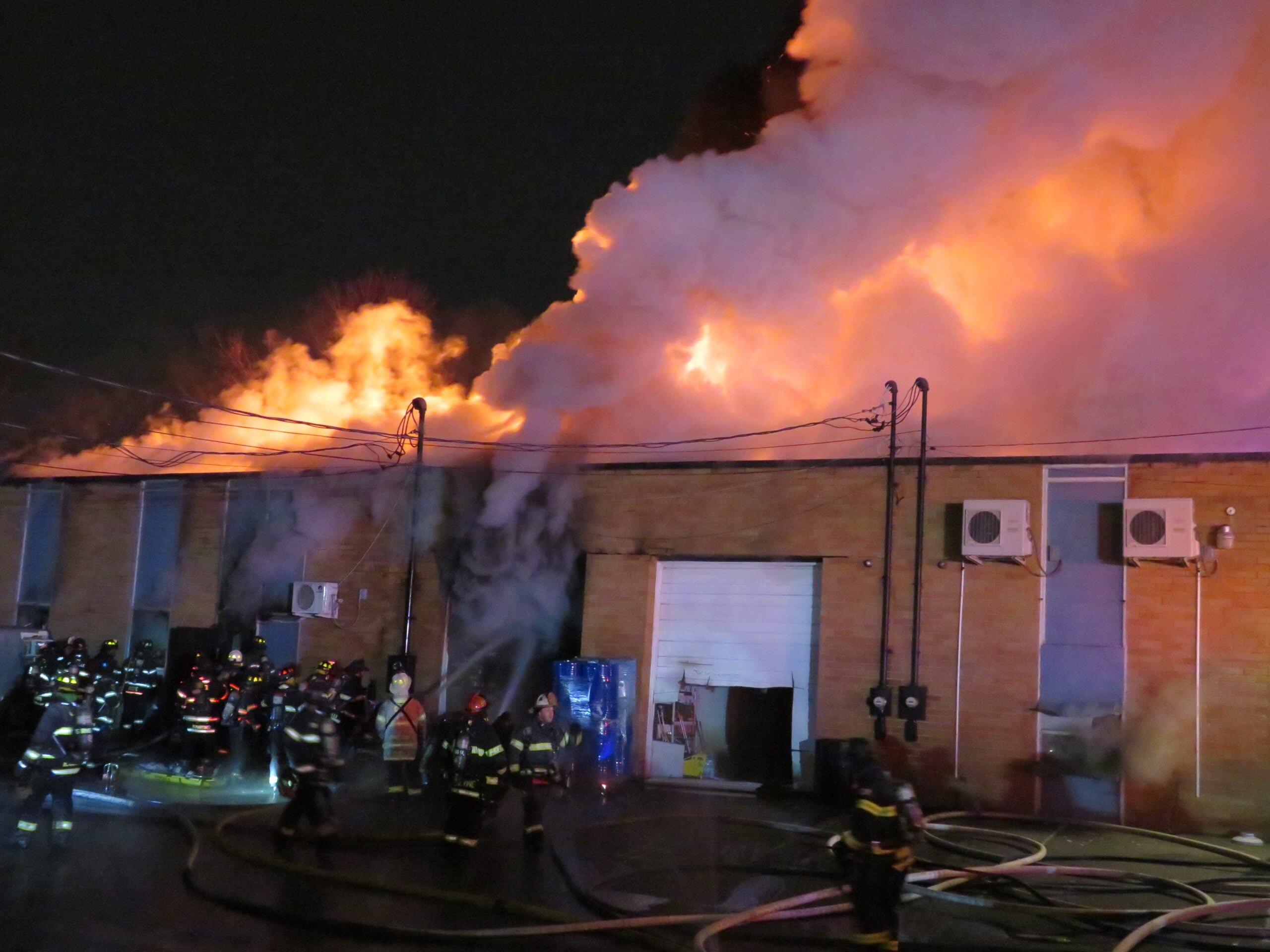 Warehouse fire in North Amityville injures two firefighters