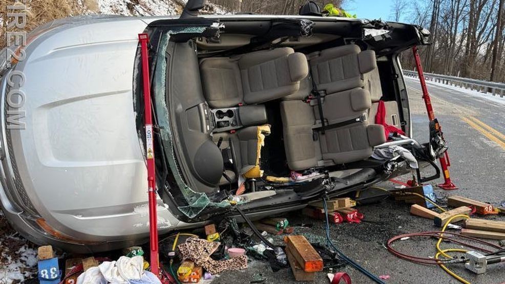 Car flips on side, traps driver's leg in door in accident on New Year's Day