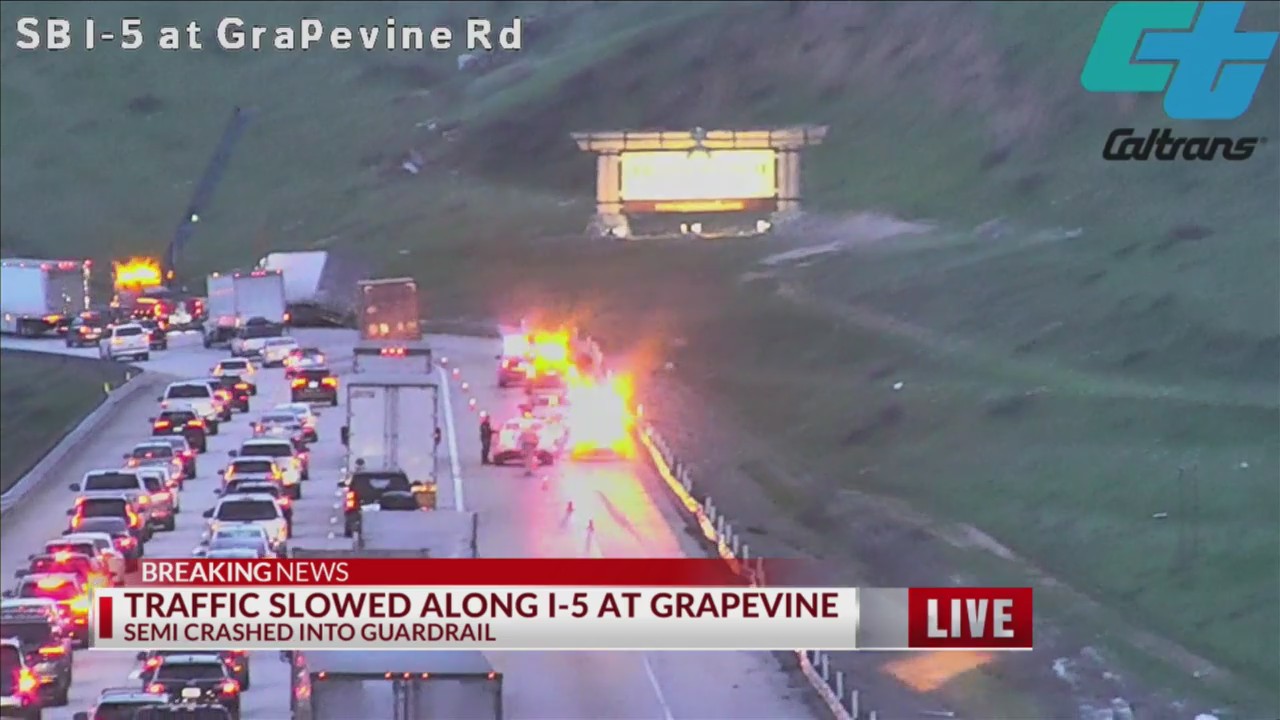 Semi-truck crashes into guardrail along I-5 causing delays