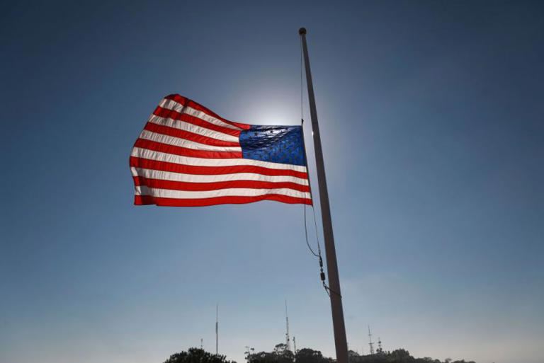 Why will flags in Colorado lower to half-staff Saturday?