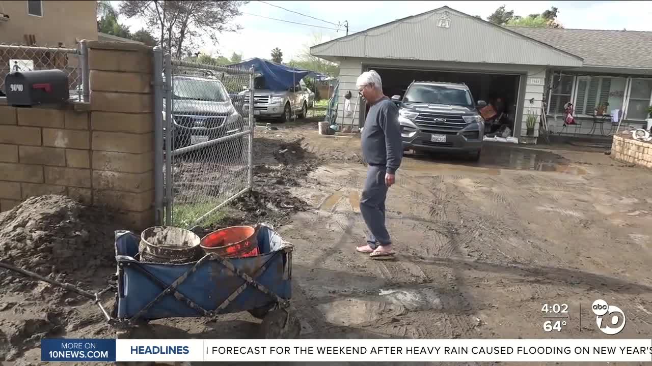 Mobile home park cleaning up after damage
