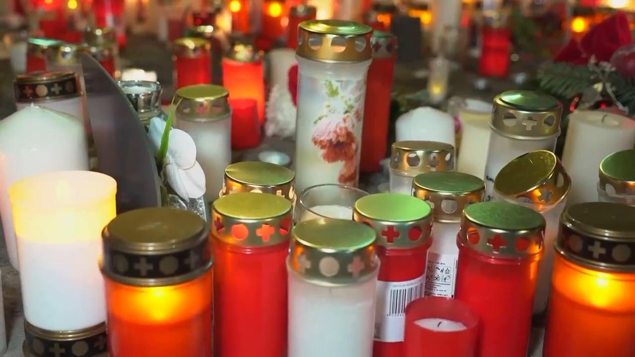 Swiss investigators believe sparkling candles atop wine bottles ignited ...