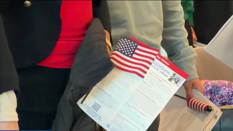 Immigrants sue federal government over pause in processing cases