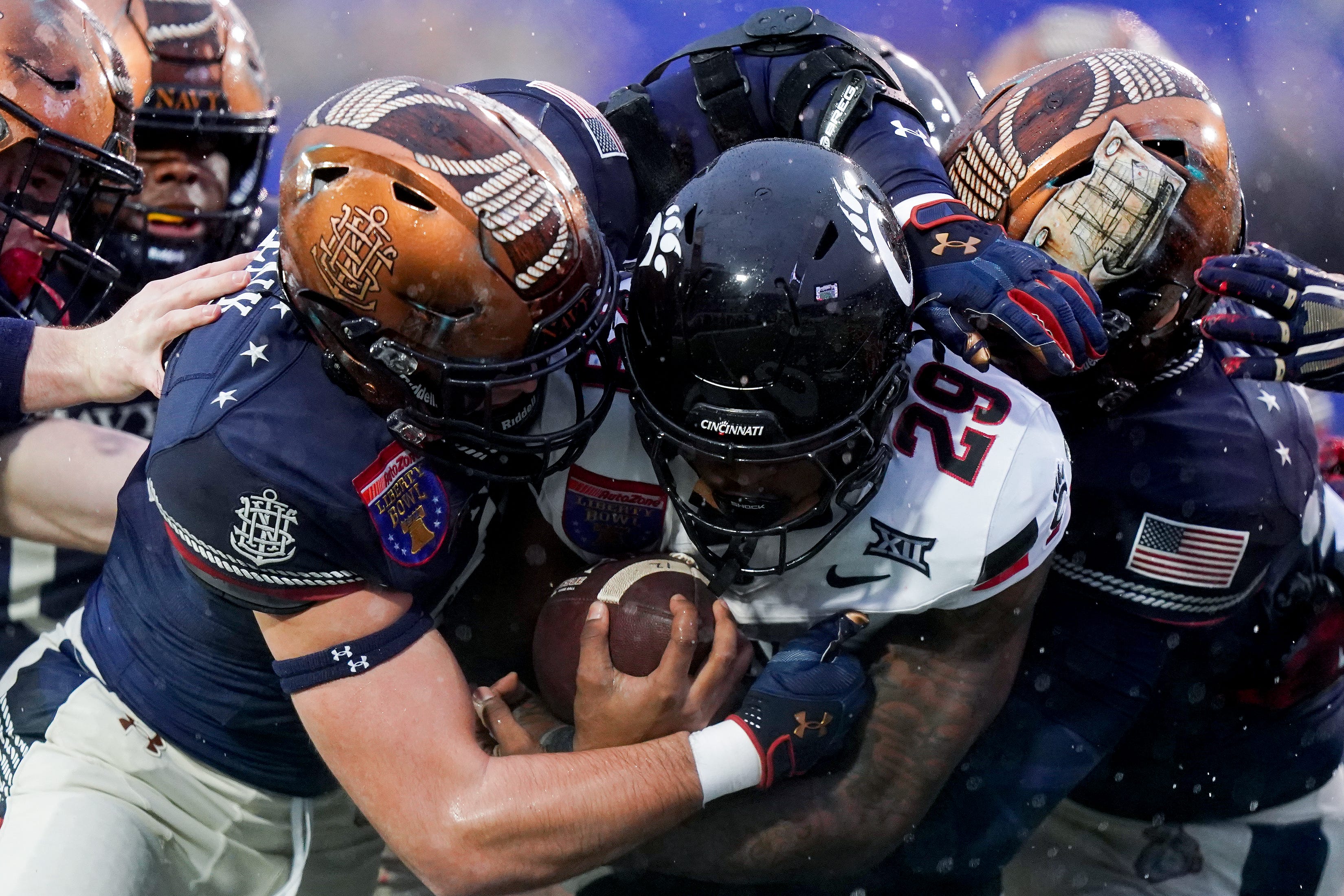 Navy rolls past Cincinnati in rain-soaked AutoZone Liberty Bowl