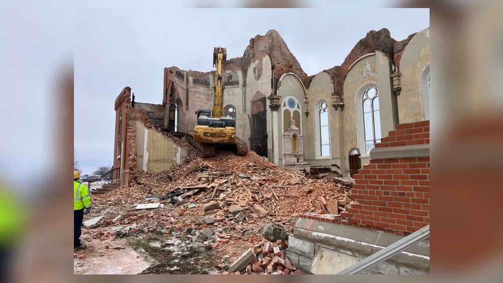 Demolition begins of historic Catholic church destroyed by fire, high winds
