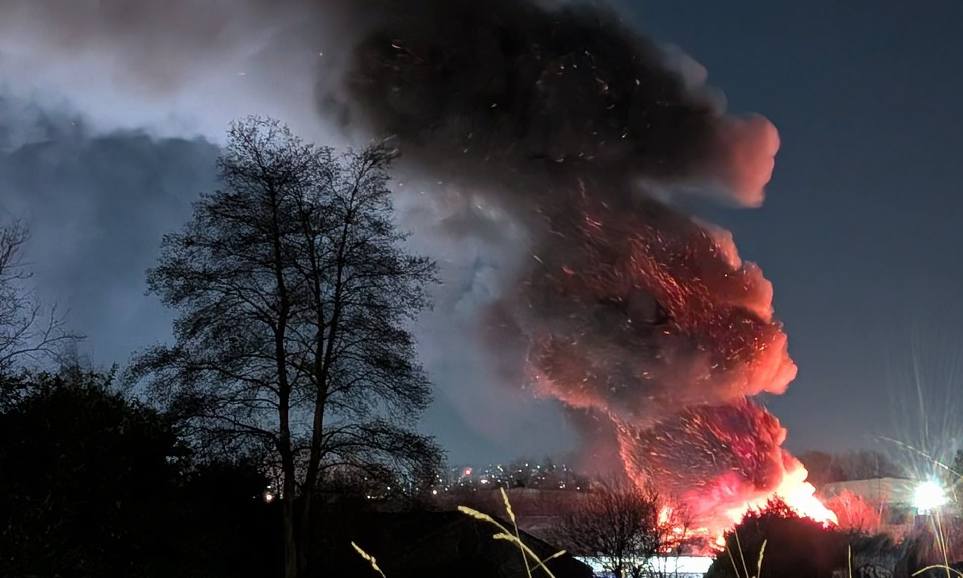 Huge blaze breaks out near shopping centre as thick plumes of smoke billow