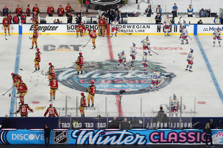 Panthers and Rangers play outdoor hockey game in Miami, replete with ...