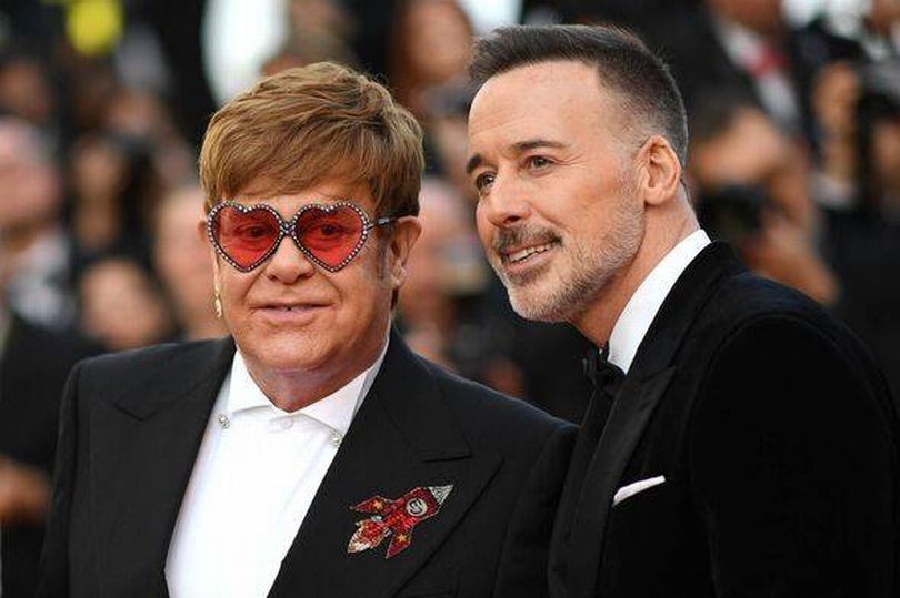 Elton John breaks strict family rule as sons' faces seen for first time ...