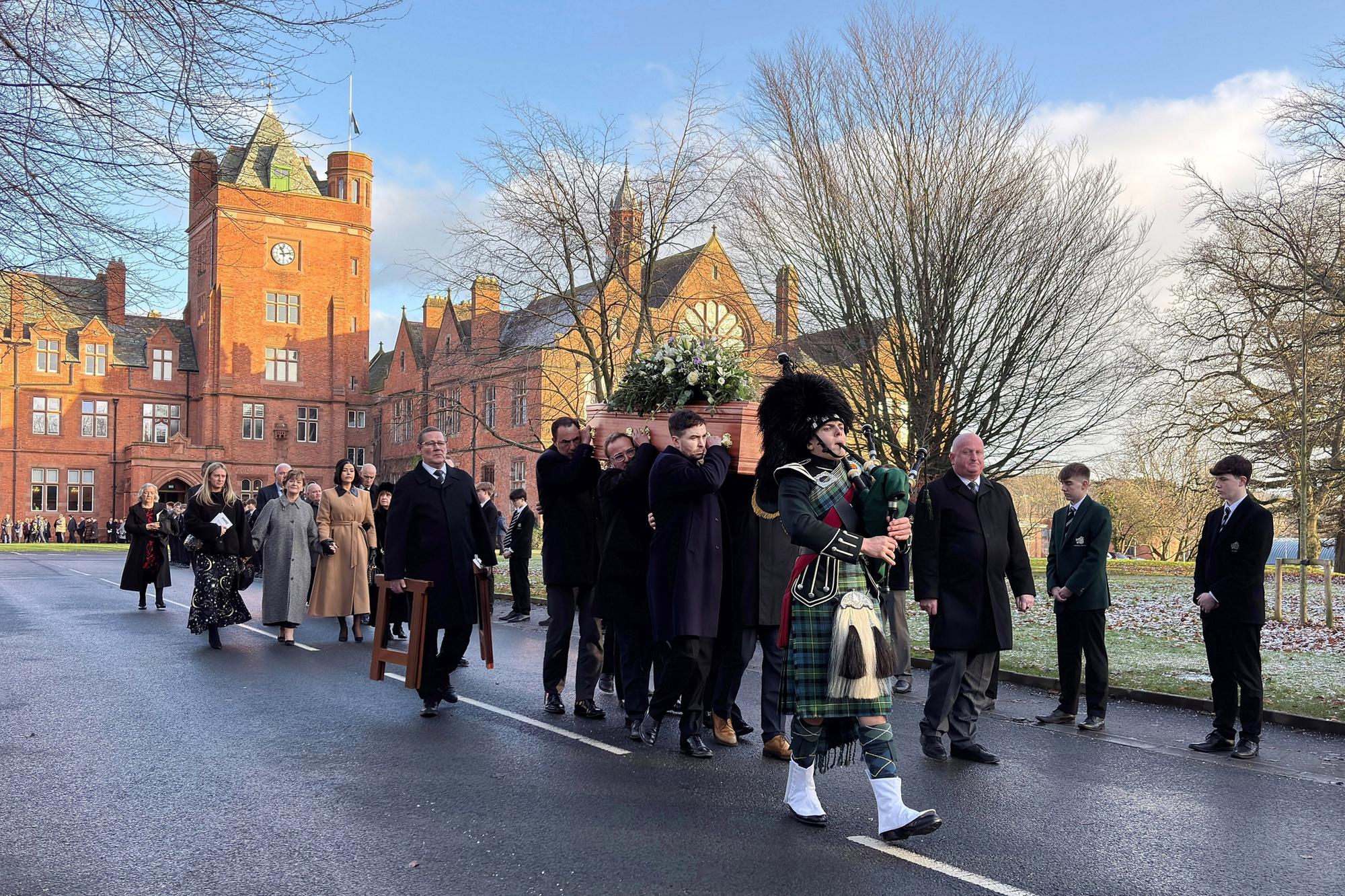 Pictures: A thousand mourners cram into school to say farewell to a ...