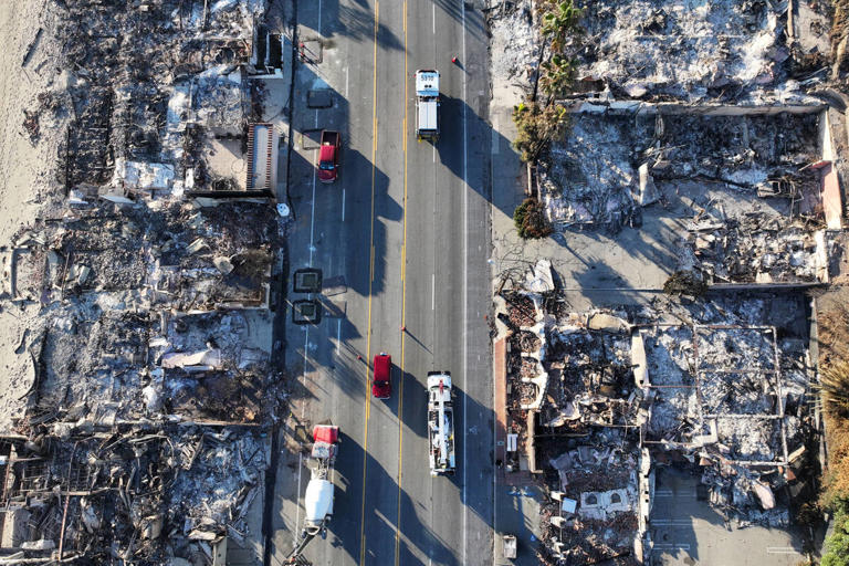 Mounted police comb through fire-charred Los Angeles for bodies