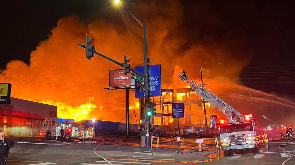 Denver fire crews rush to three-alarm fire at building under ...