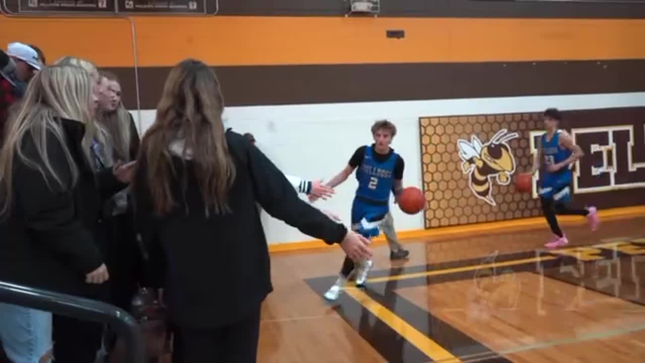 Basketball player slips into crowd during game in Michigan, USA