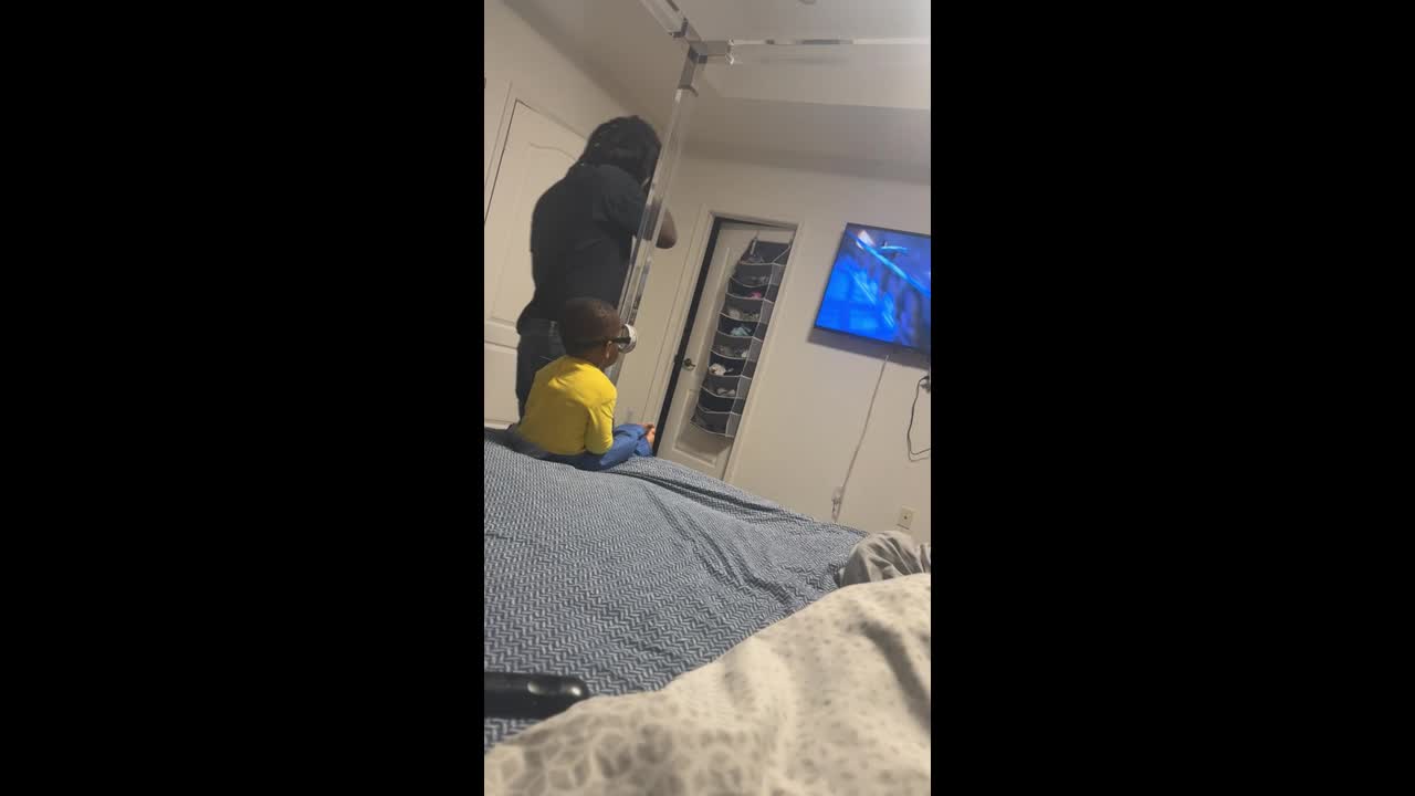 Baby makes funny Minion face while watching TV in Florida, USA