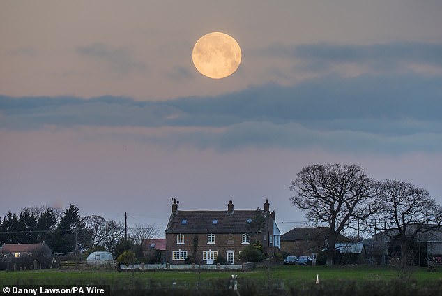 Sky-watchers post spectacular pictures of the first Wolf Moon of 2026