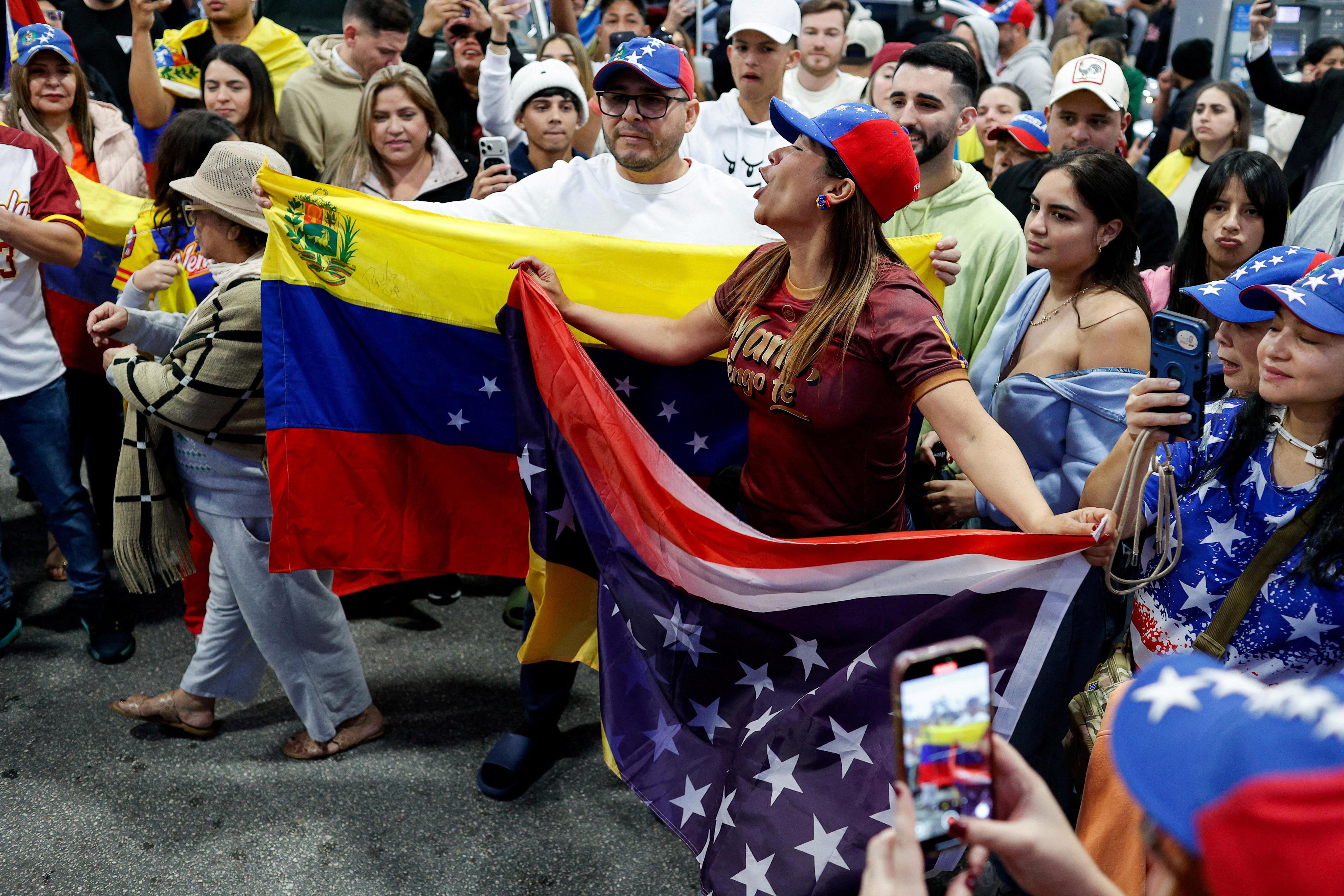 Regime change faithful toss roses at Trump after Maduro overthrow