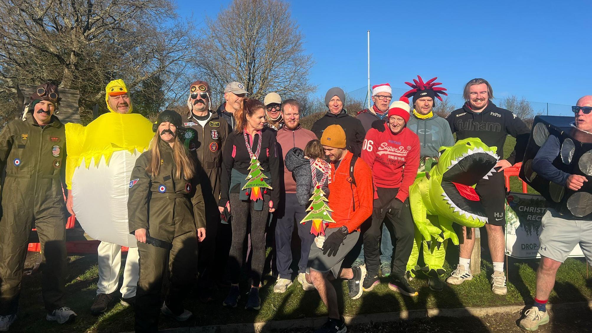 Villagers compete in Christmas tree recycling race