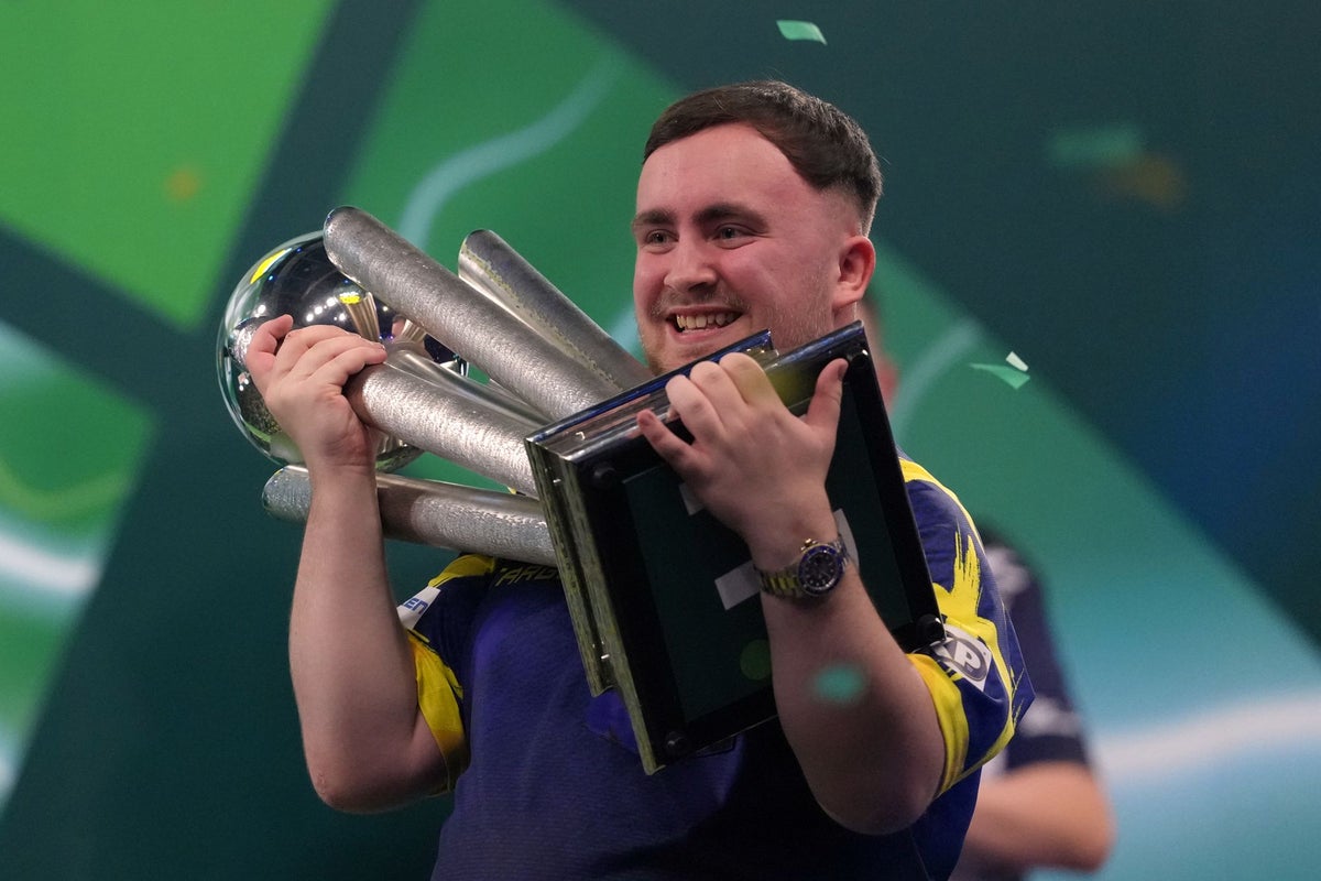 Littler routs Van Veen to win back-to-back World Darts Championships