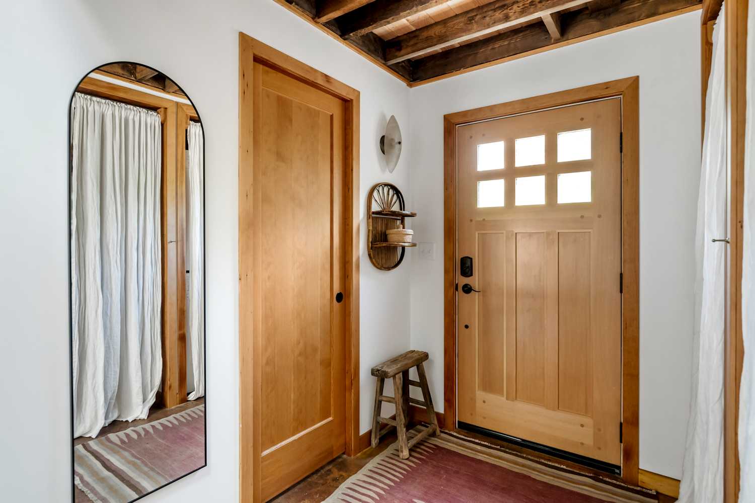 Hanging a curtain in this surprising spot makes any home 10x cozier