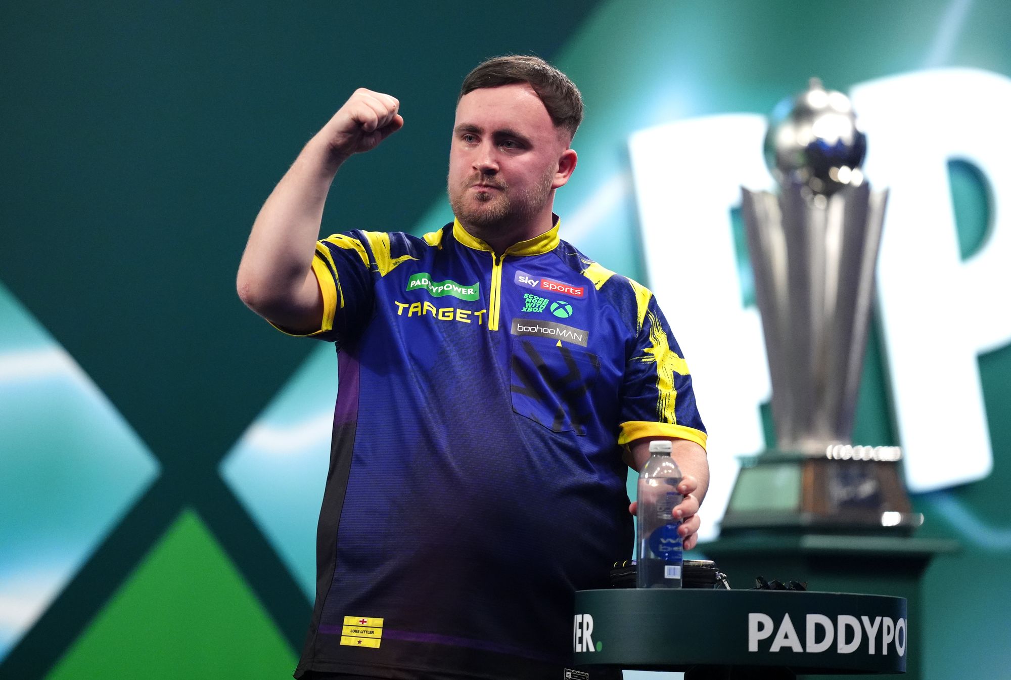 Littler routs Van Veen to win back-to-back World Darts Championships