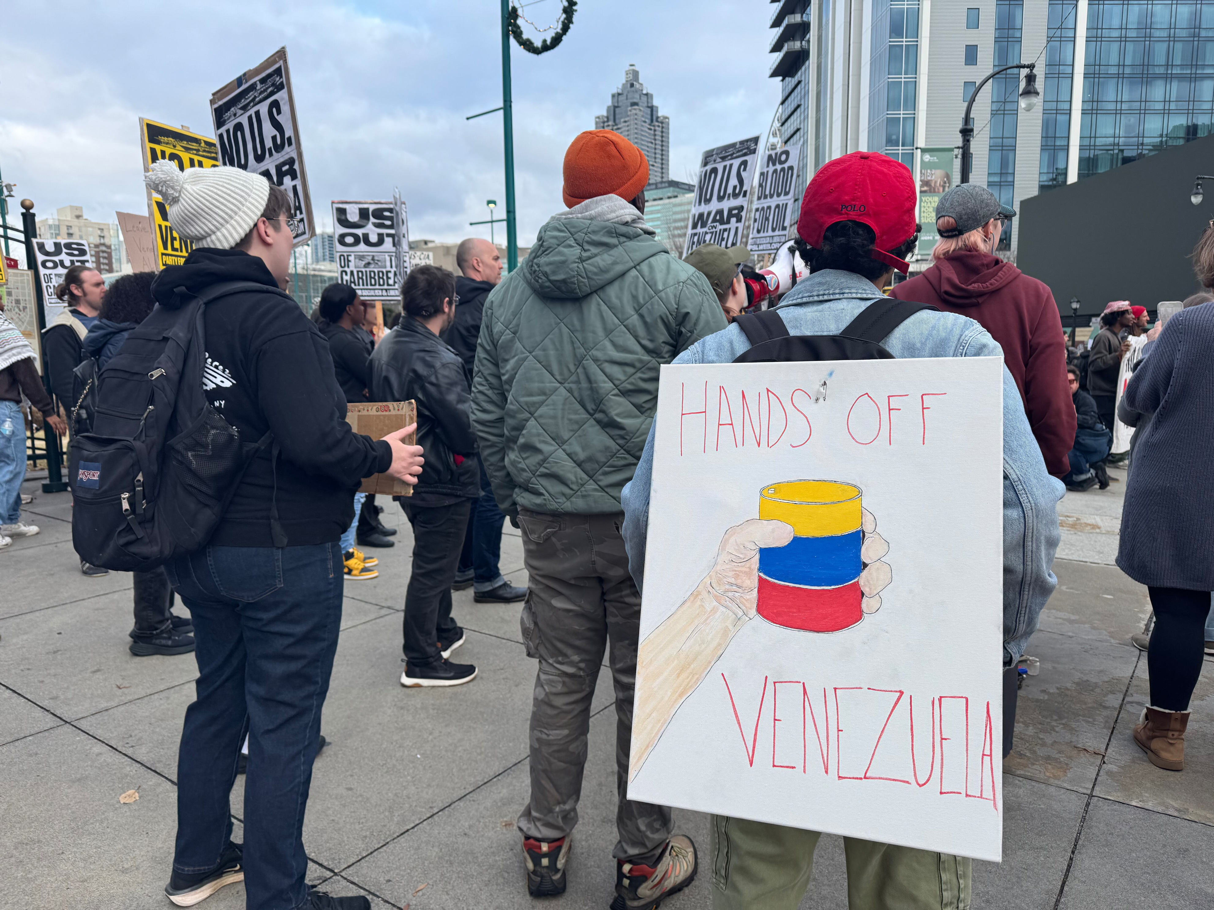 Rallygoers in metro Atlanta protest US strike in Venezuela, while ...