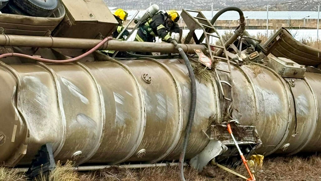 Crude oil tanker overturns, semi driver ticketed