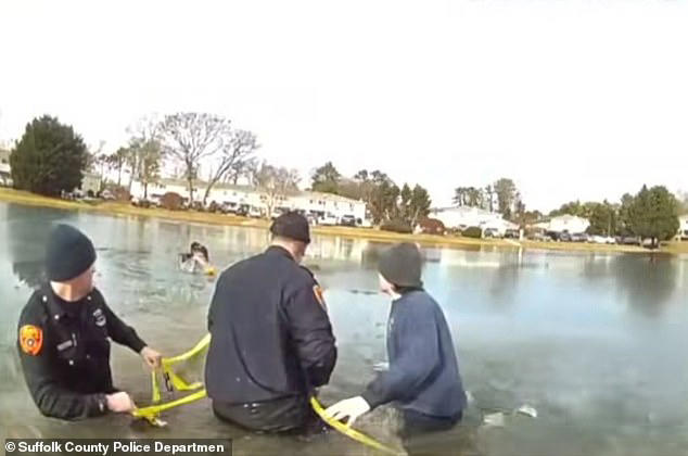 Dramatic moment cops rescue eight-year-old boy who fell through the ice ...