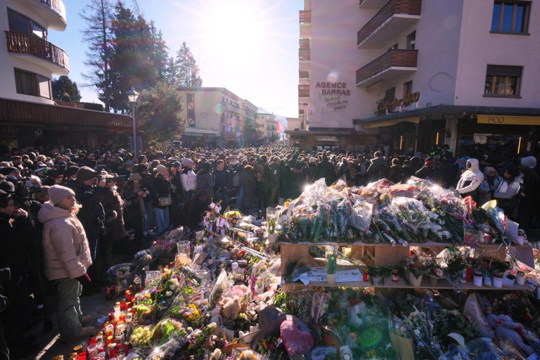 Hundreds march in silence to honor victims of Swiss bar fire that left ...