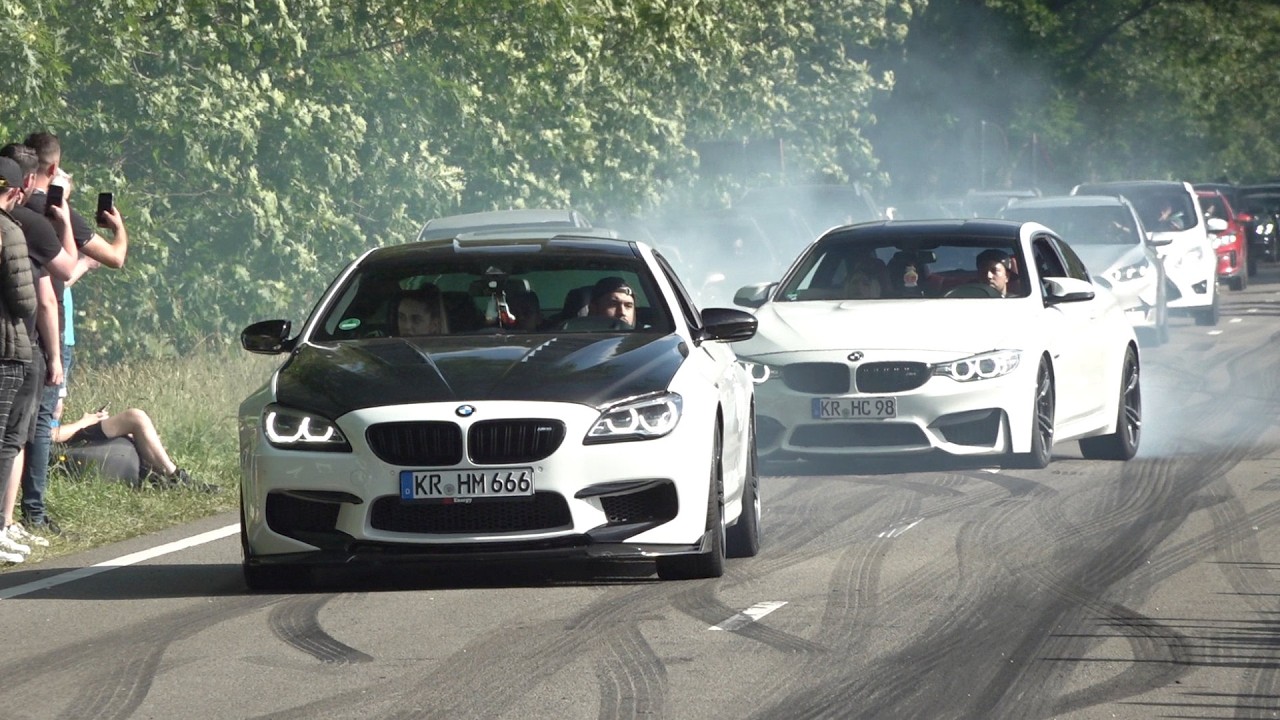 BMW M performance cars creating smoke and tire marks