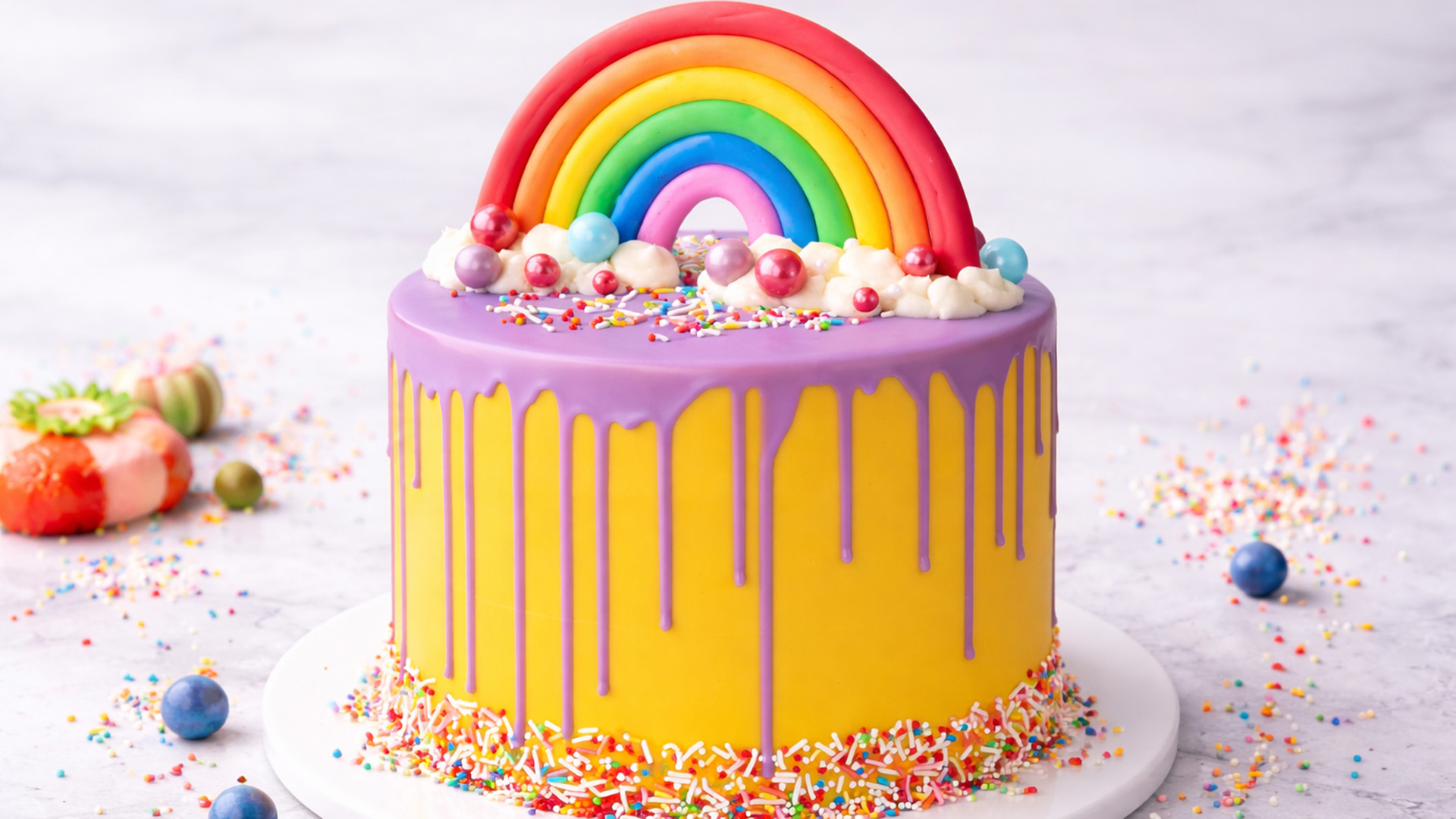 How to make a colorful rainbow drip cake