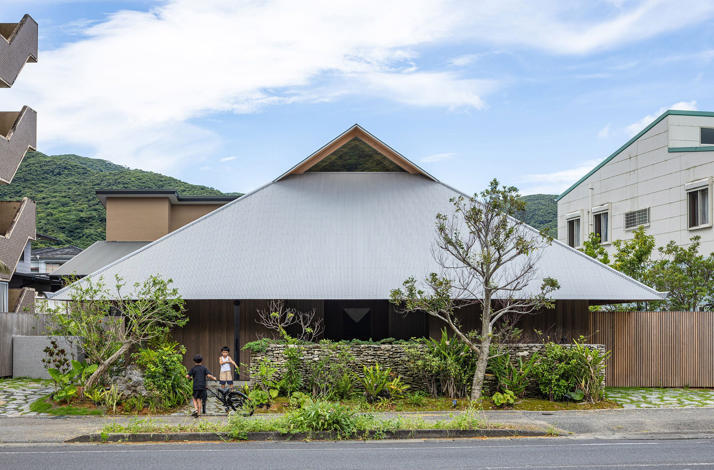 Large metal roof tops off-grid home on Japanese island by Sakai Architects