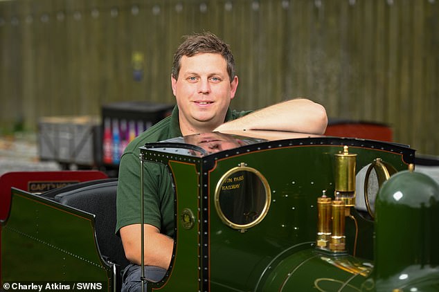 Train enthusiast spends five years making a working miniature railway ...