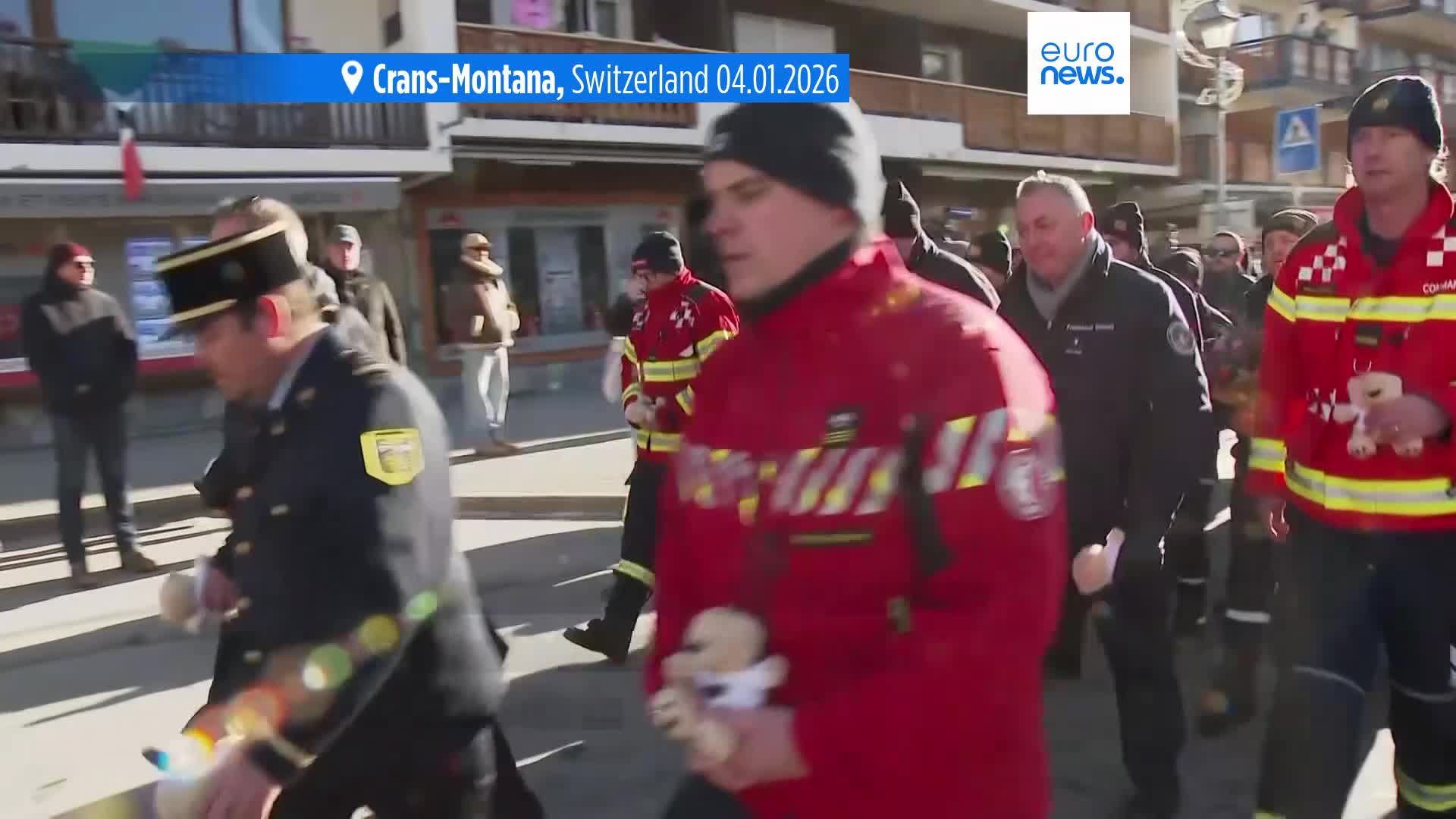 Hundreds march in silence to honour Swiss Alps bar fire victims