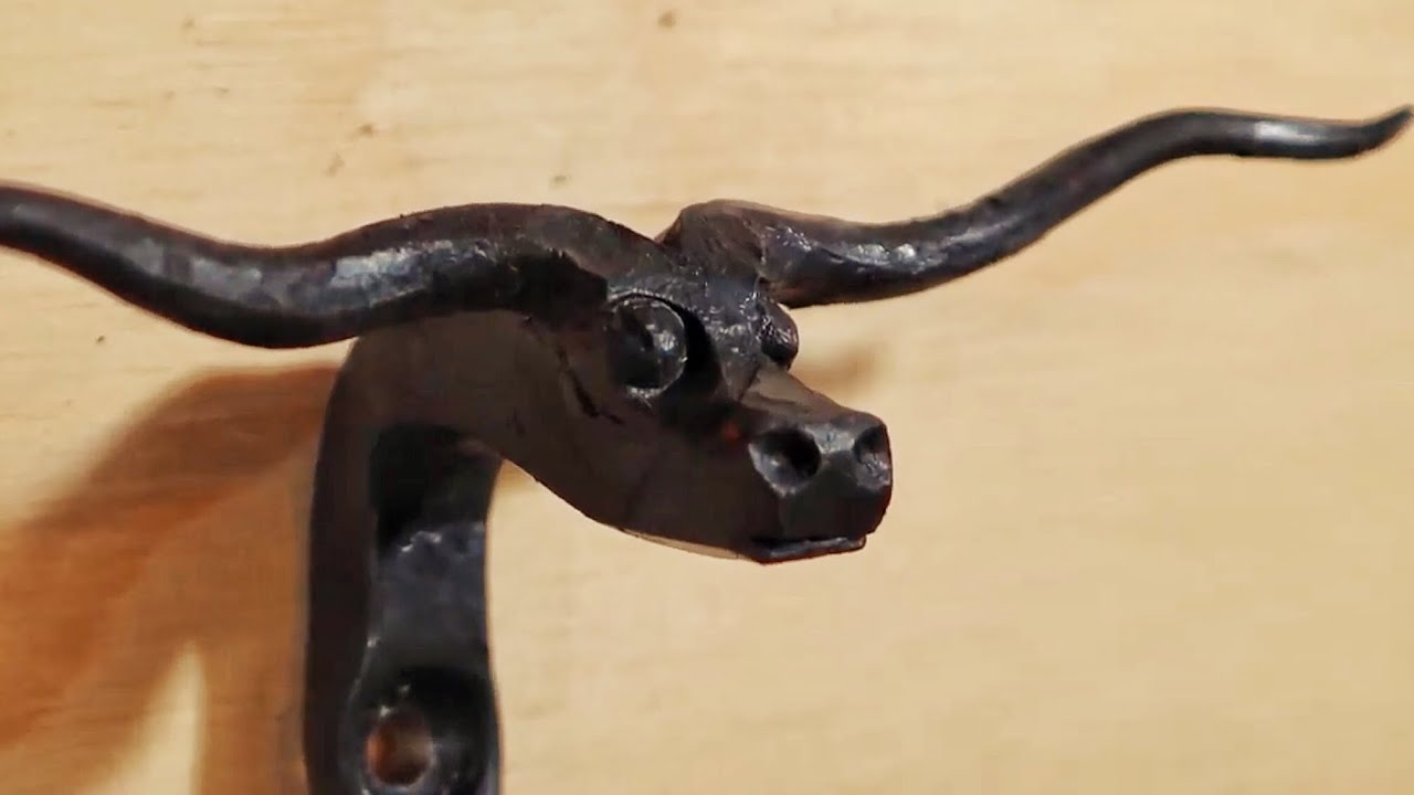Forging a new hook; longhorn steer