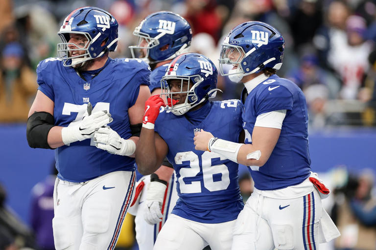 Owner John Mara gets a game ball after Giants beat the Cowboys 34-17 in ...