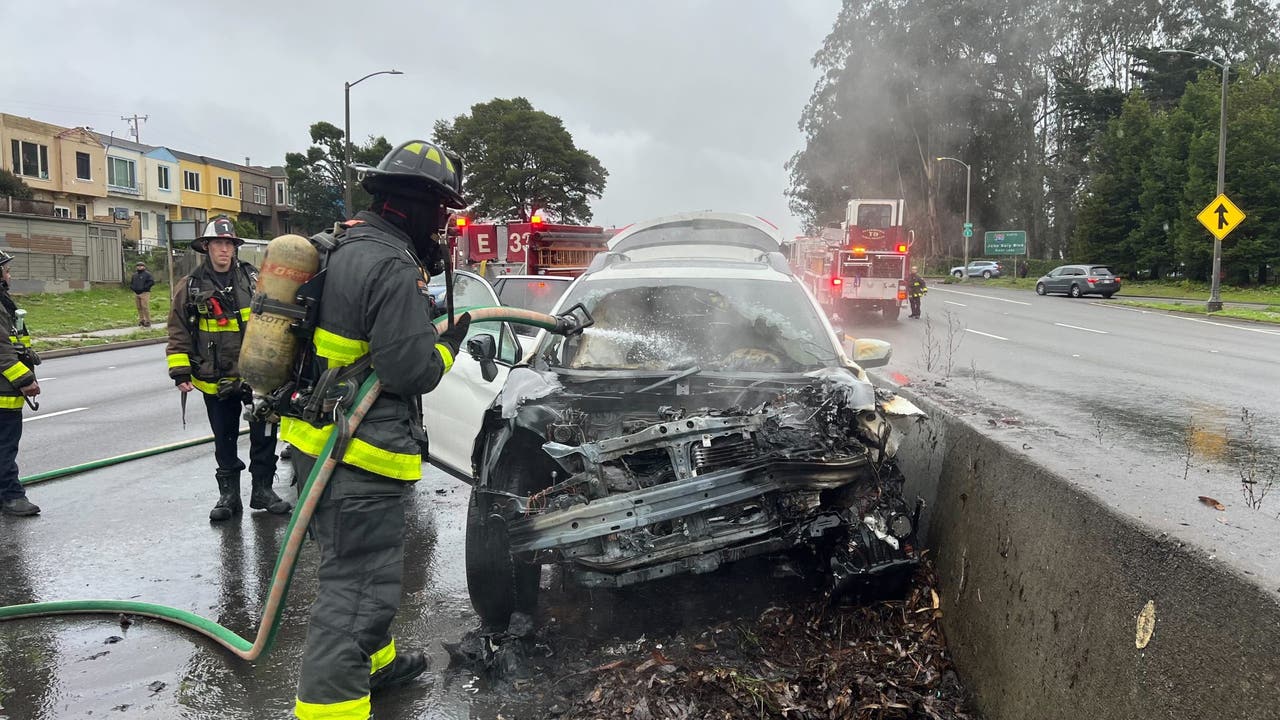 Firefighters rescue occupants from burning car in San Francisco