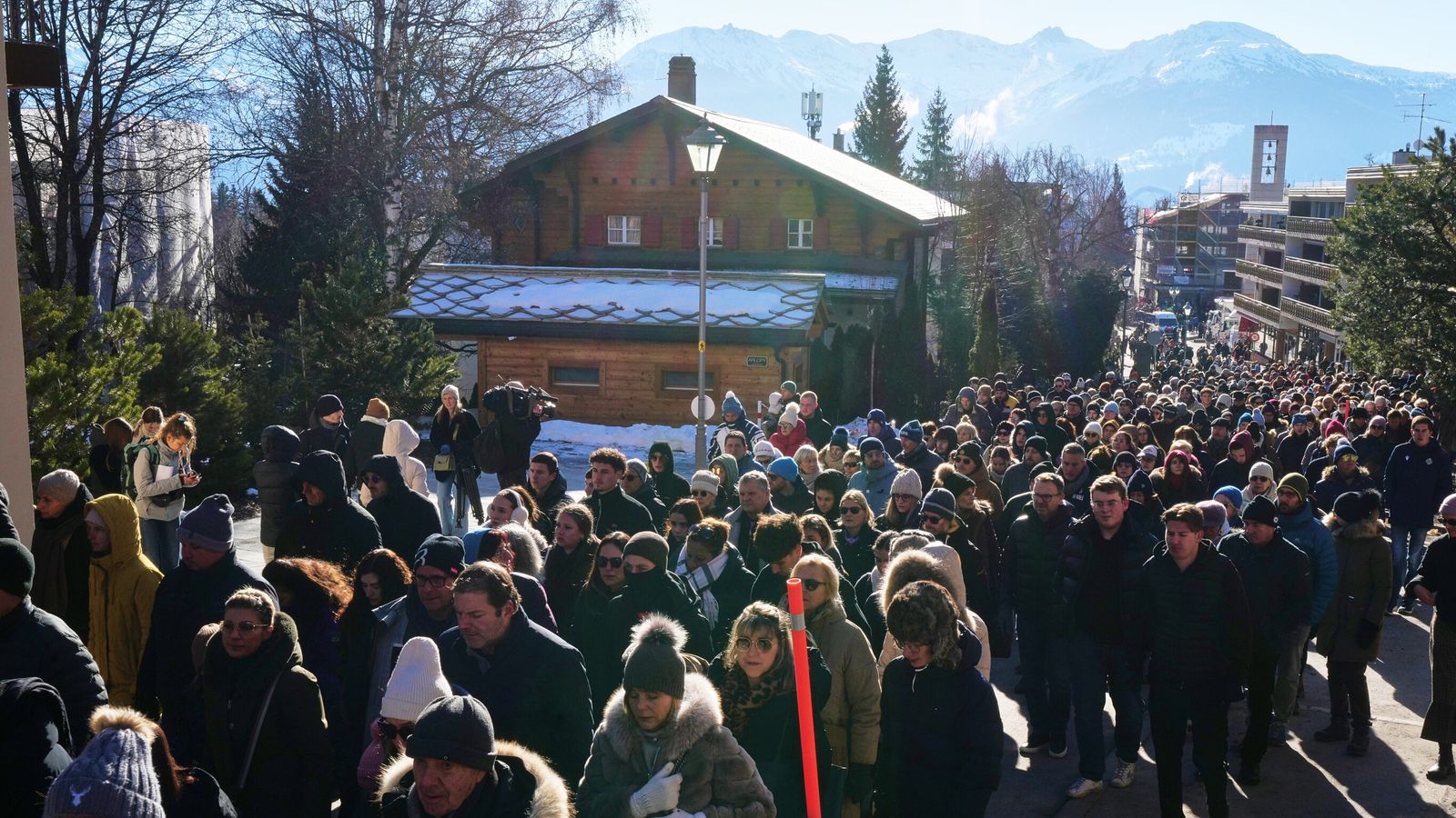 Five people named as Swiss bar fire victims - as hundreds march in silence