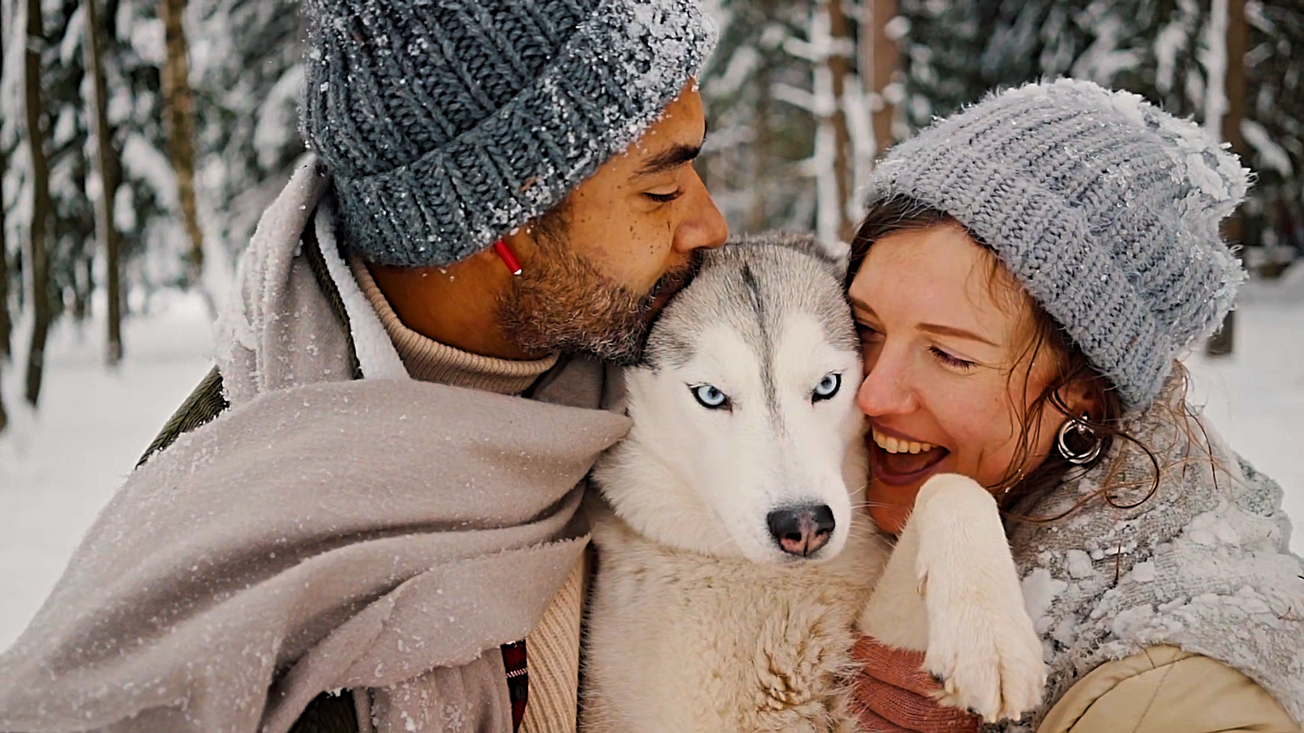 A couple kisses their dog and receives a rare reaction