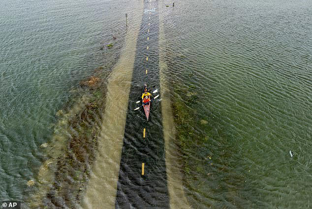 Super moon 'trifecta' causes intense flooding as terrified residents ...
