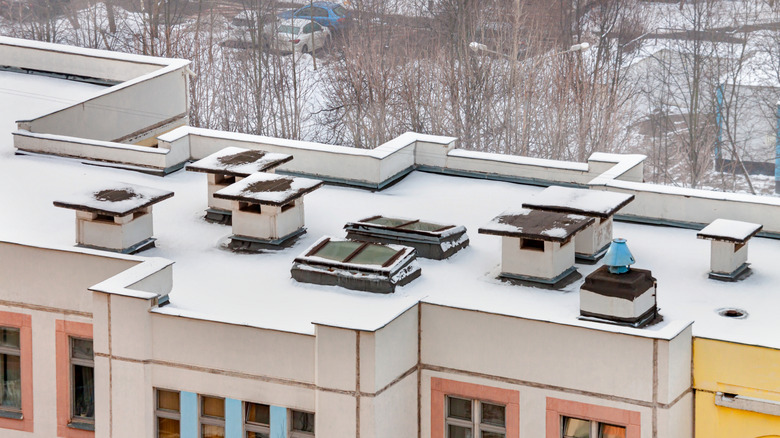 How to safely remove snow from your flat roof