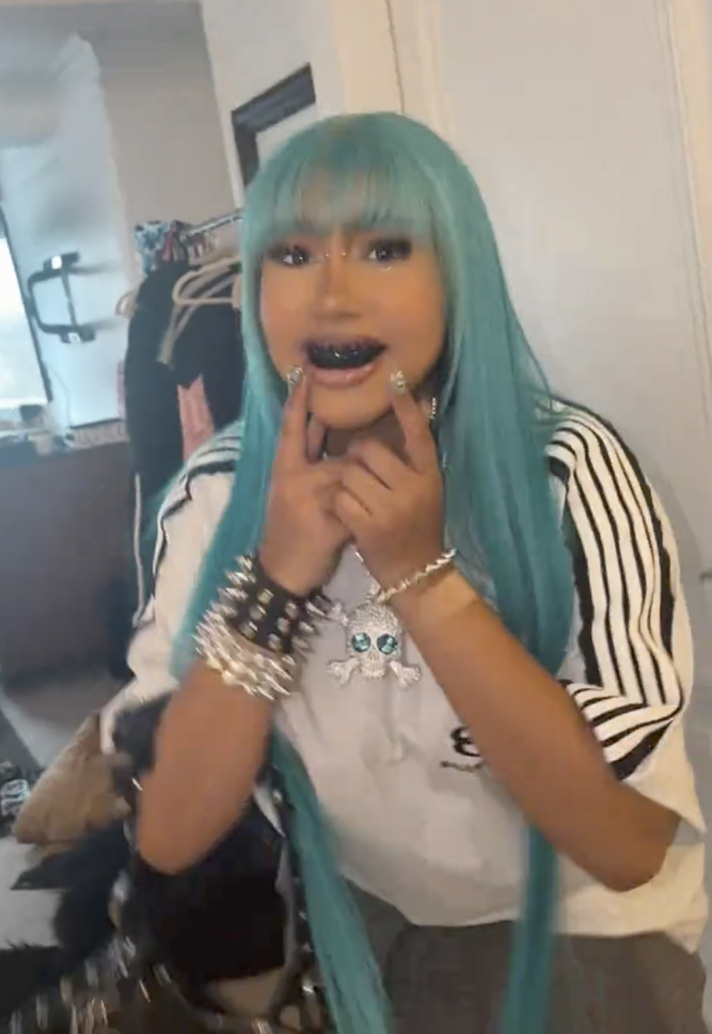 North West, 12, shows off new bridge piercing, blackened teeth and 106 ...