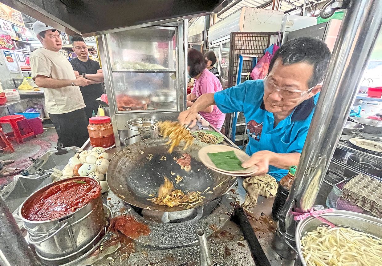 ‘Foreign workers essential to hawker food preparation’