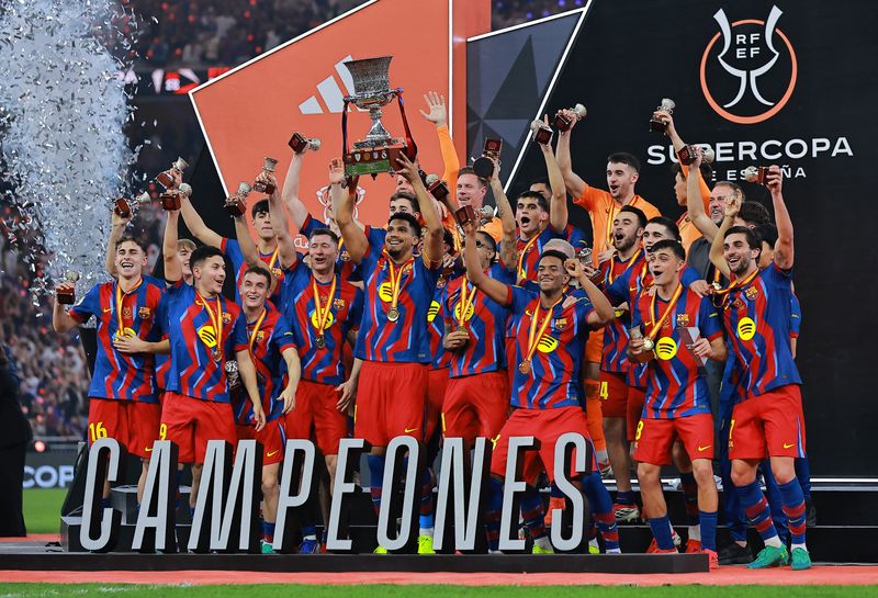 Soccer-Raphinha strikes twice as Barcelona edge Real Madrid in heated ...