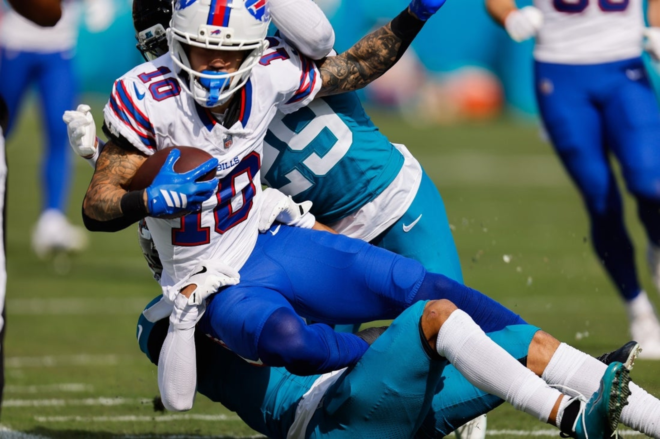Bills overcome Jaguars 27-24 to end road playoff woes
