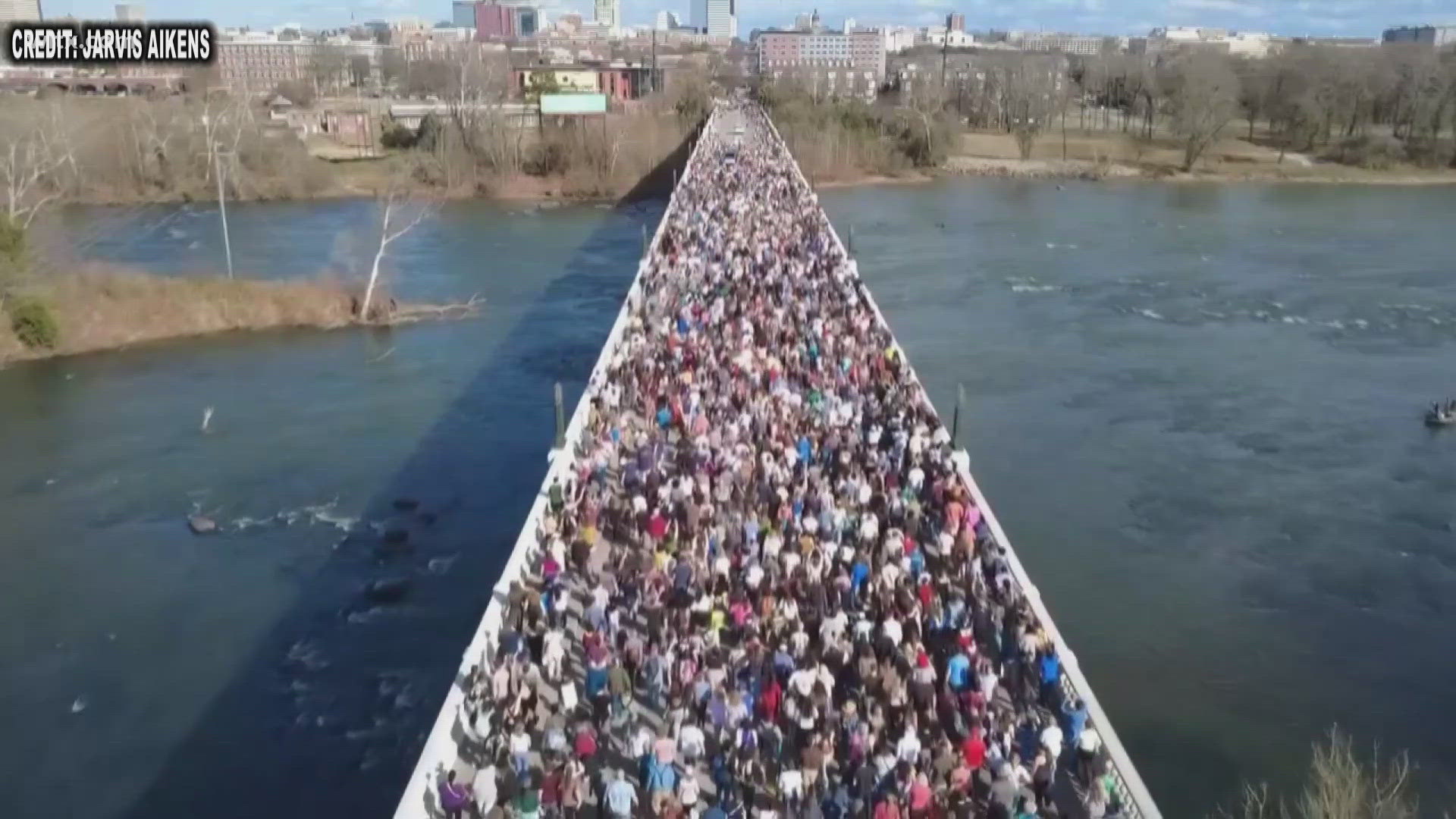 Buddhist monks cross Gervais Street Bridge on walk for peace
